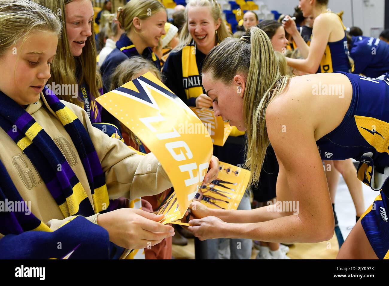 Cara Koenen of the Lightning signs autographs after the Super Netball ...