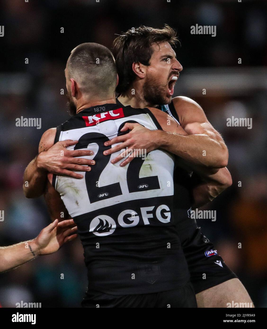 Sam Mayes of the Power celebrates kicking the winning goal with team ...