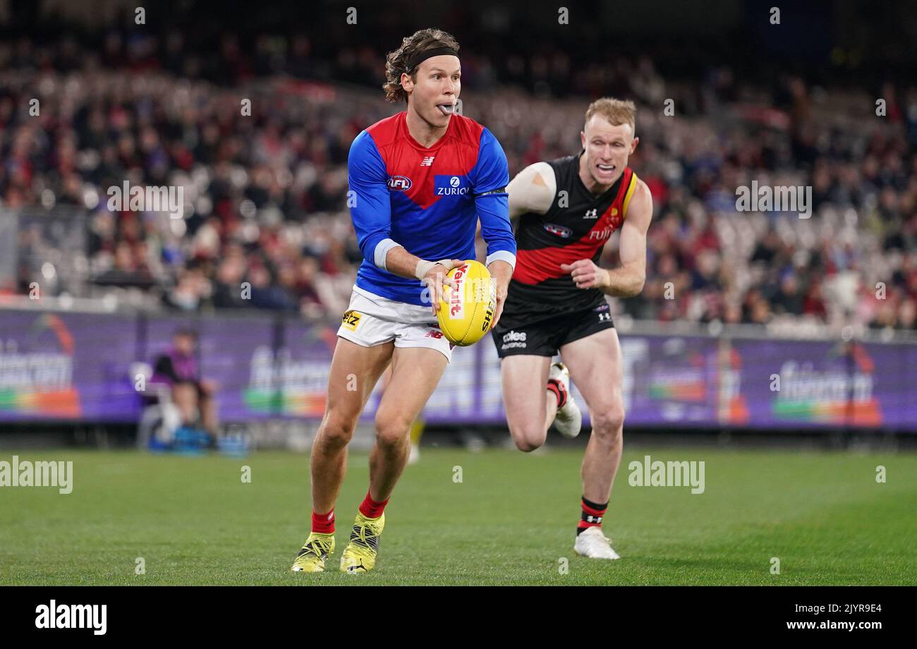 Ed Langdon of the Demons runs with the ball during the AFL Round 15 ...