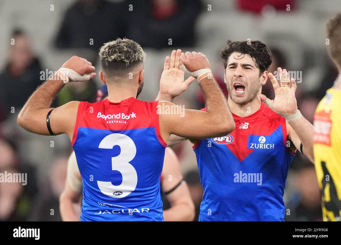 Christian Petracca of the Demons celebrates after kicking a goal with ...