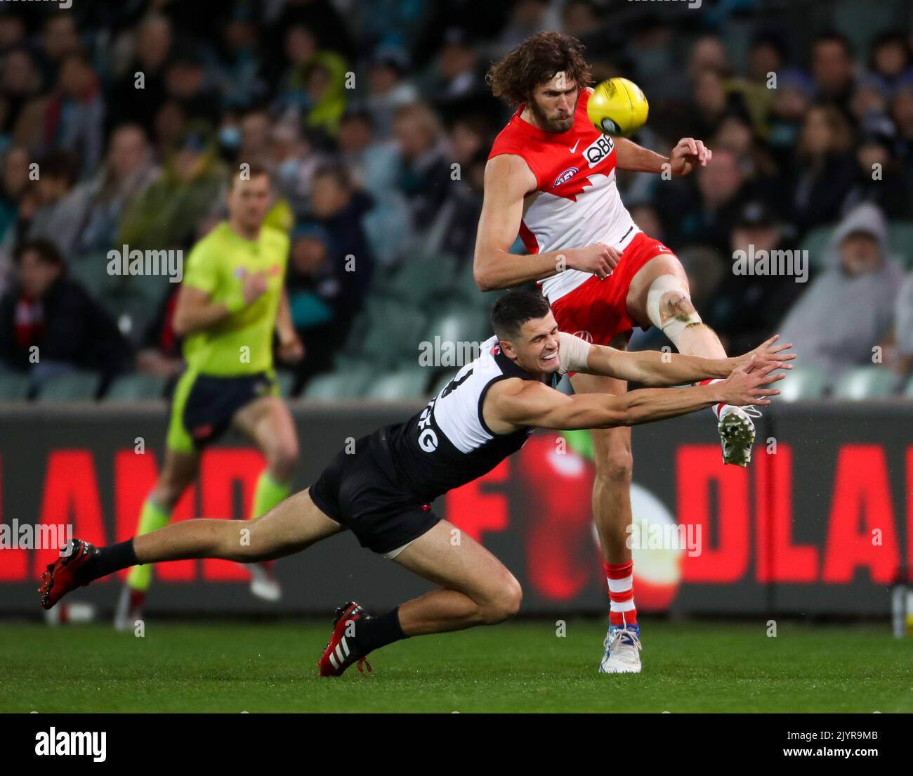 Ryan Burton of the Power dives to smother the kick of Tom Hickey of the ...