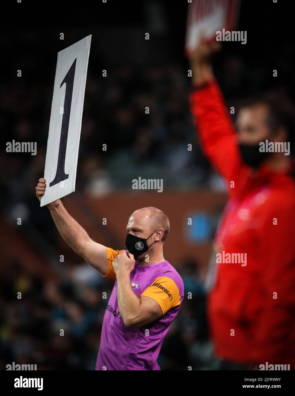 Chad Cornes, Forward Development Coach of the Power and runner, holds ...