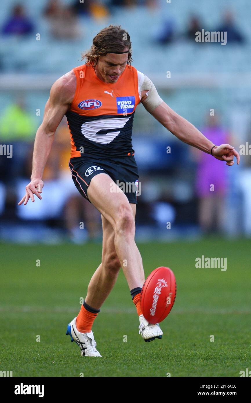 Adam Kennedy of the Giants kicks the footy during the Round 15 AFL ...