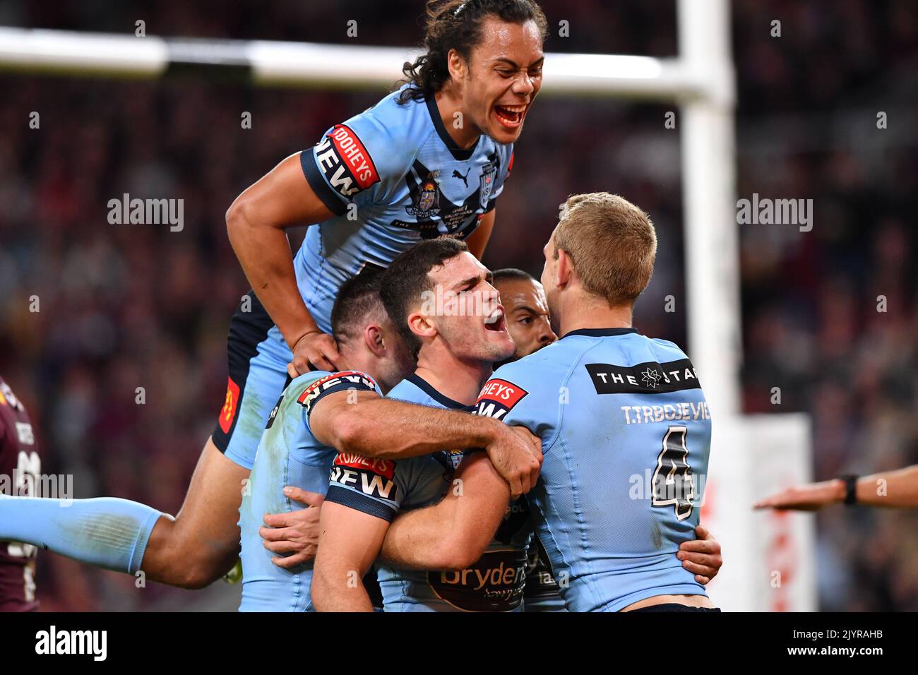 Tom Trbojevic (right) of the Blues celebrates scoring a try with Jarome ...