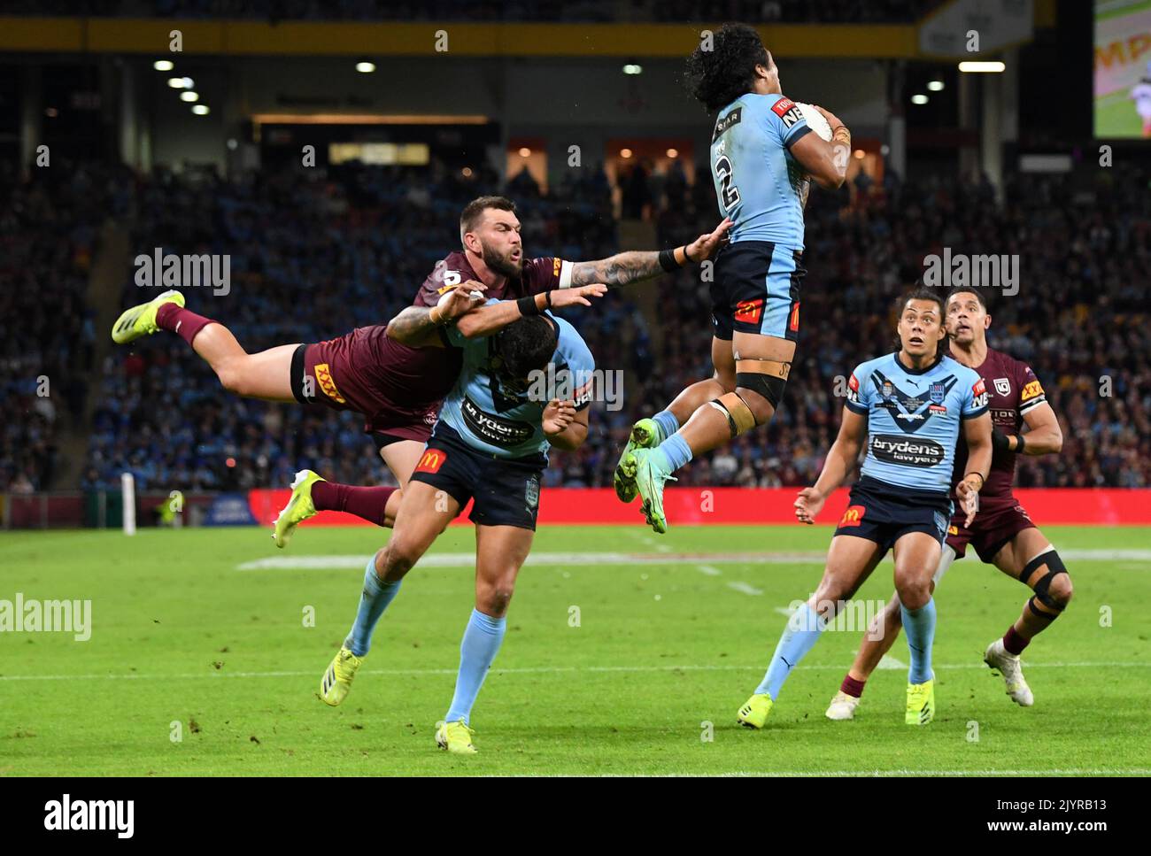 Brian To'o (centre) of the Blues takes the high ball as Kyle Feldt ...