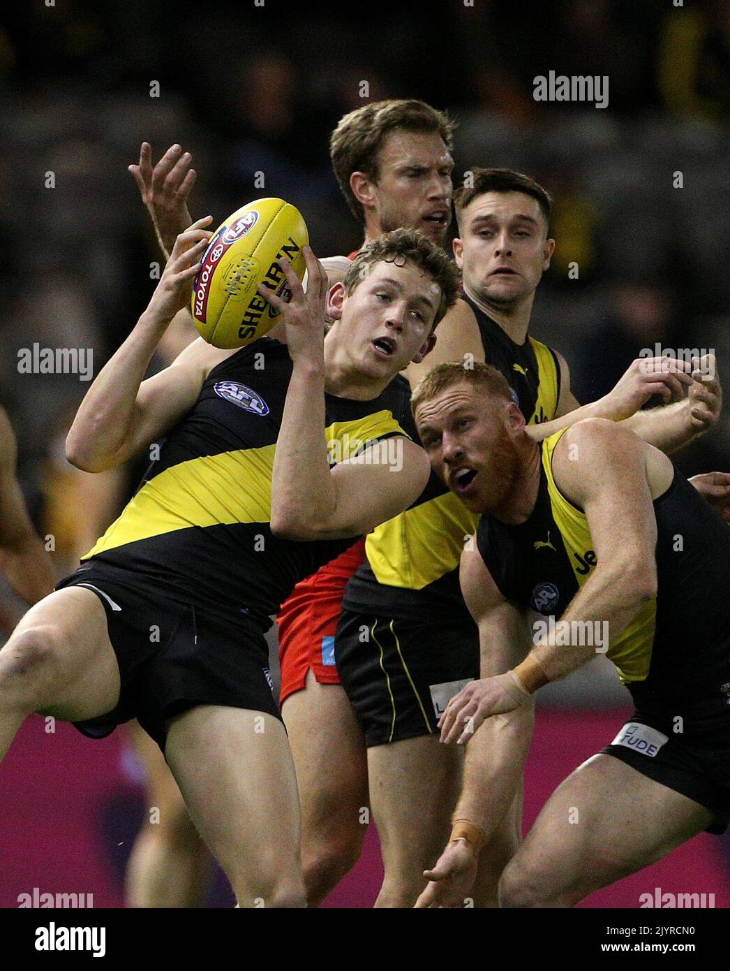 Riley Collier-Dawkins of the Tigers (left) marks during the Round 16 ...