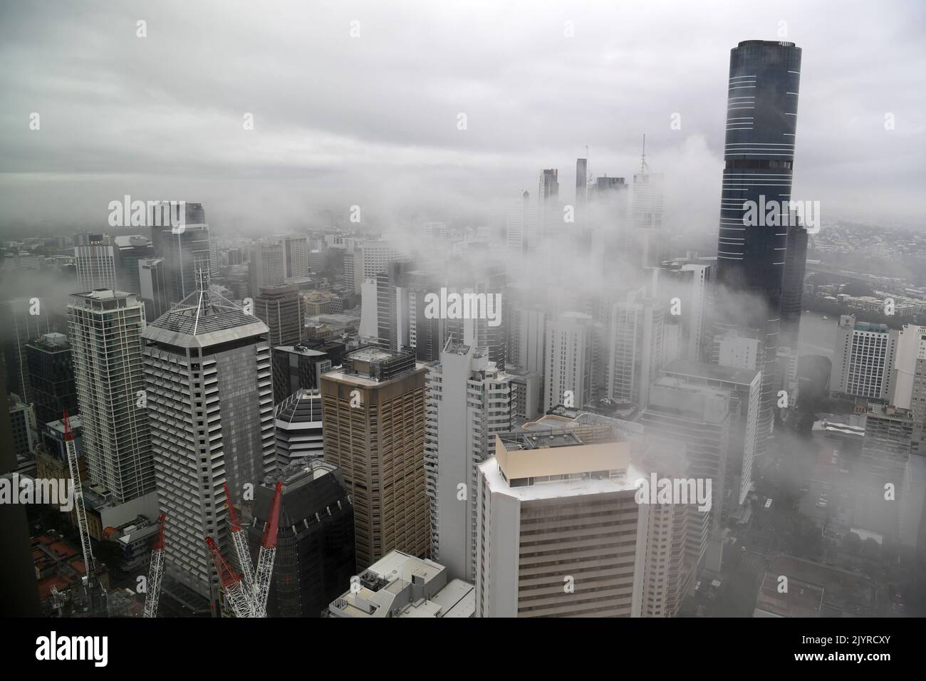 The Brisbane CBD is seen covered in a layer of fog in Brisbane, Friday ...