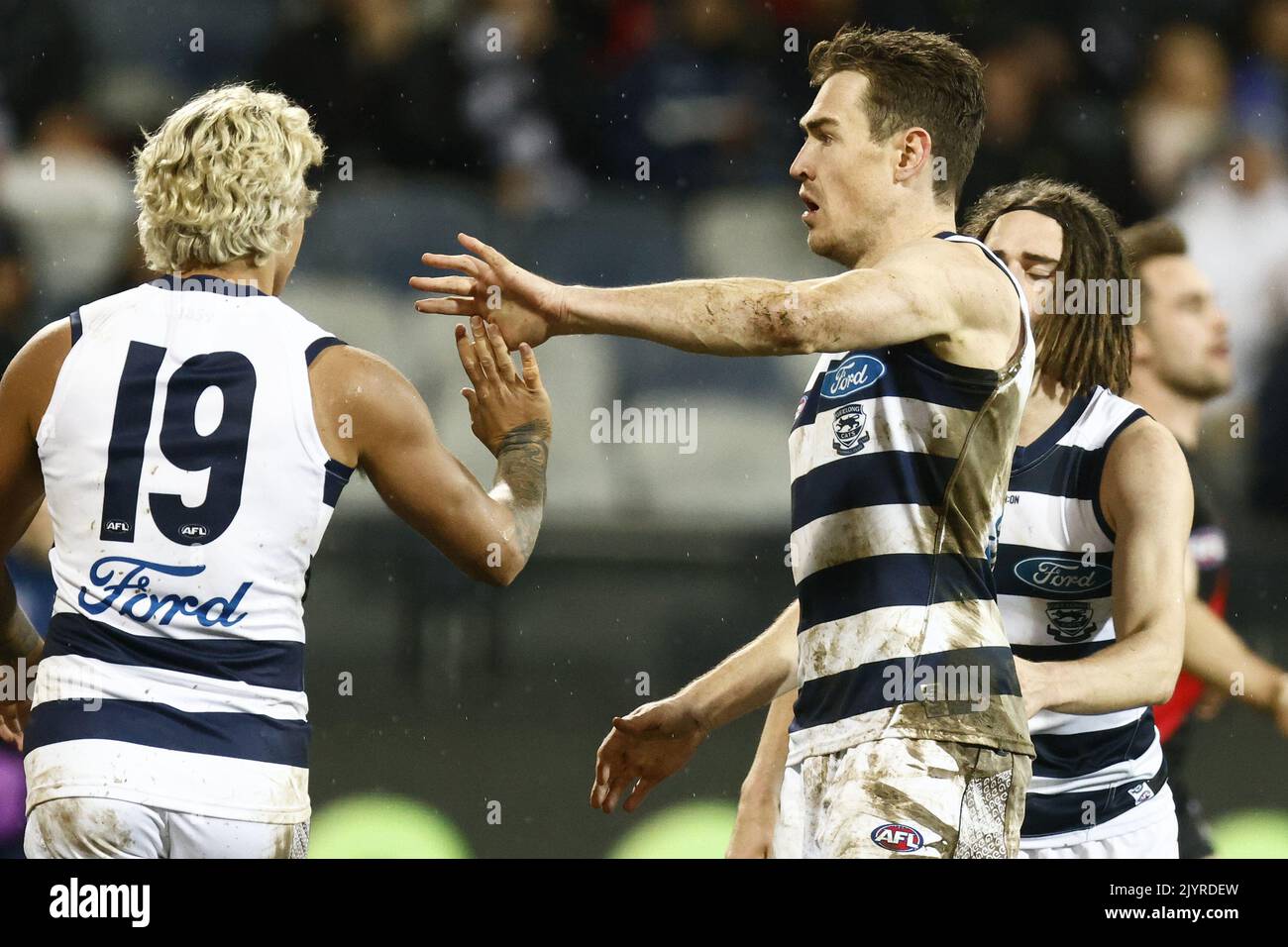 Jeremy Cameron of the Cats (right) celebrates a goal during the Round ...