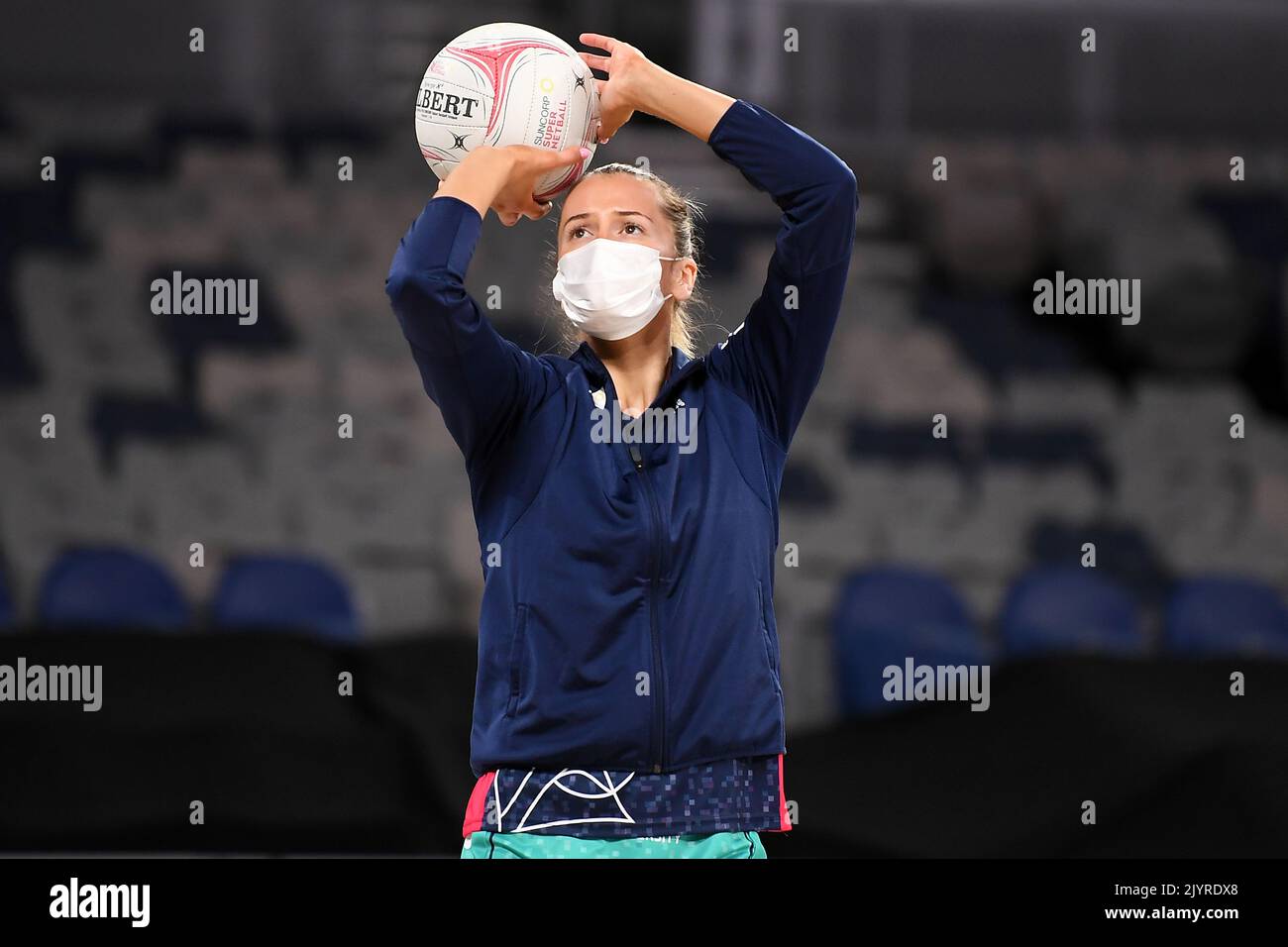 Ruby Barkmeyer of the Vixens warms up ahead of the Super Netball Round ...