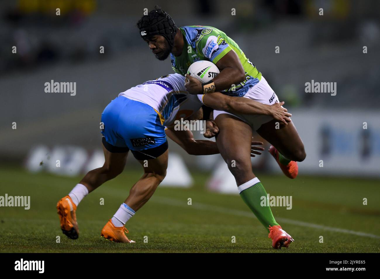 Semi Valemei of the Raiders (right) is tailed by Corey Thompson of the ...