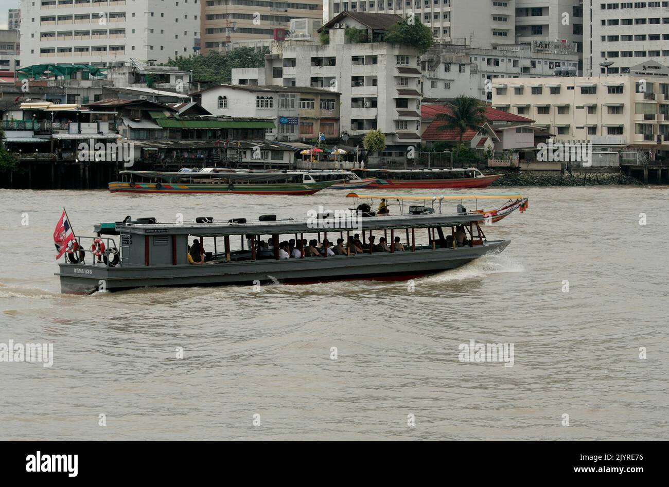 BANGKOK,THAILAND-JULY 07,2008:Passengers traveling with a Ferry on Chao ...