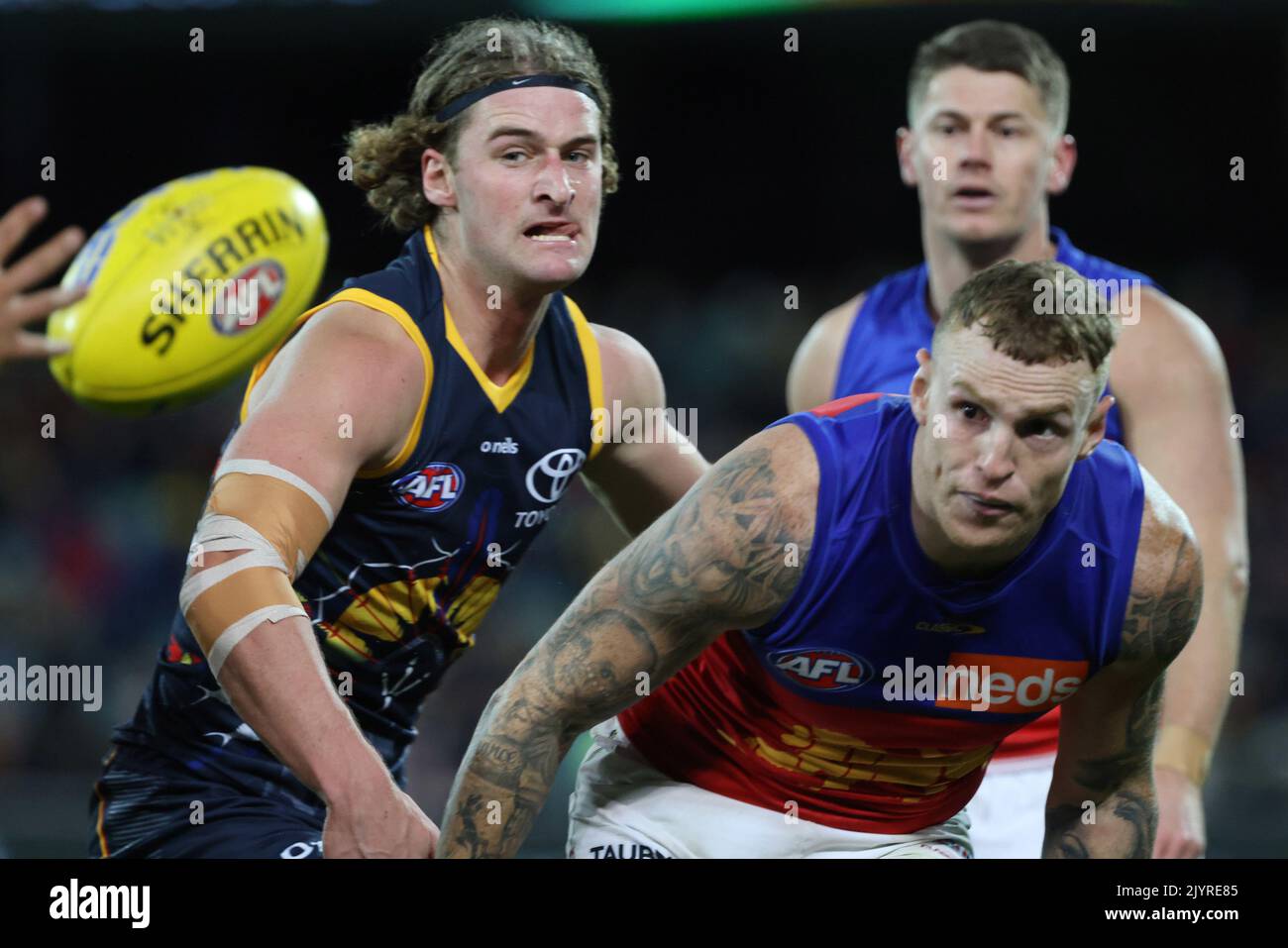 Sam Berry of the Crows and Mitch Robinson of the Lions during the AFL ...