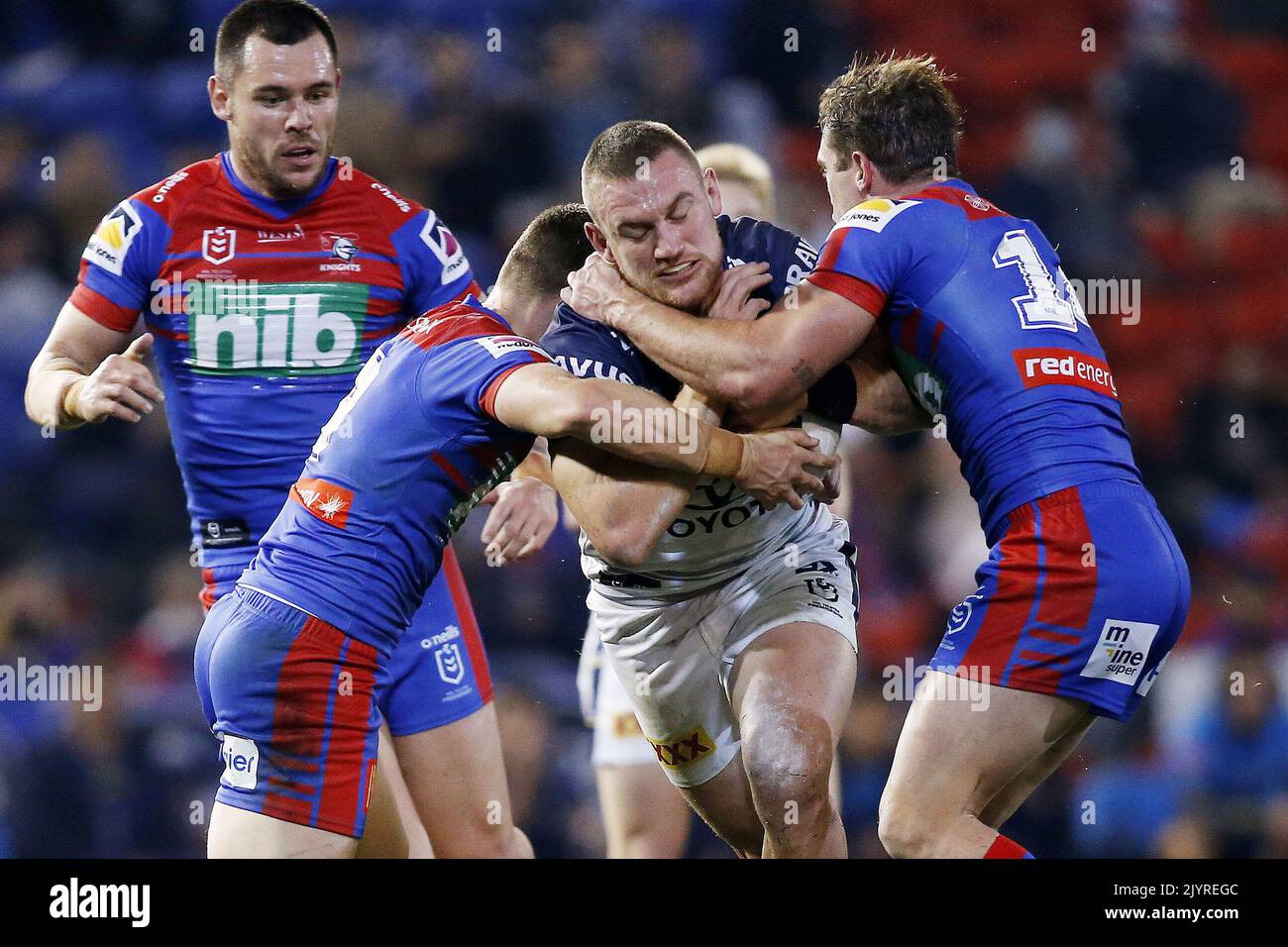 Coen Hess of the Cowboys is tackled during the NRL Round 16 match ...