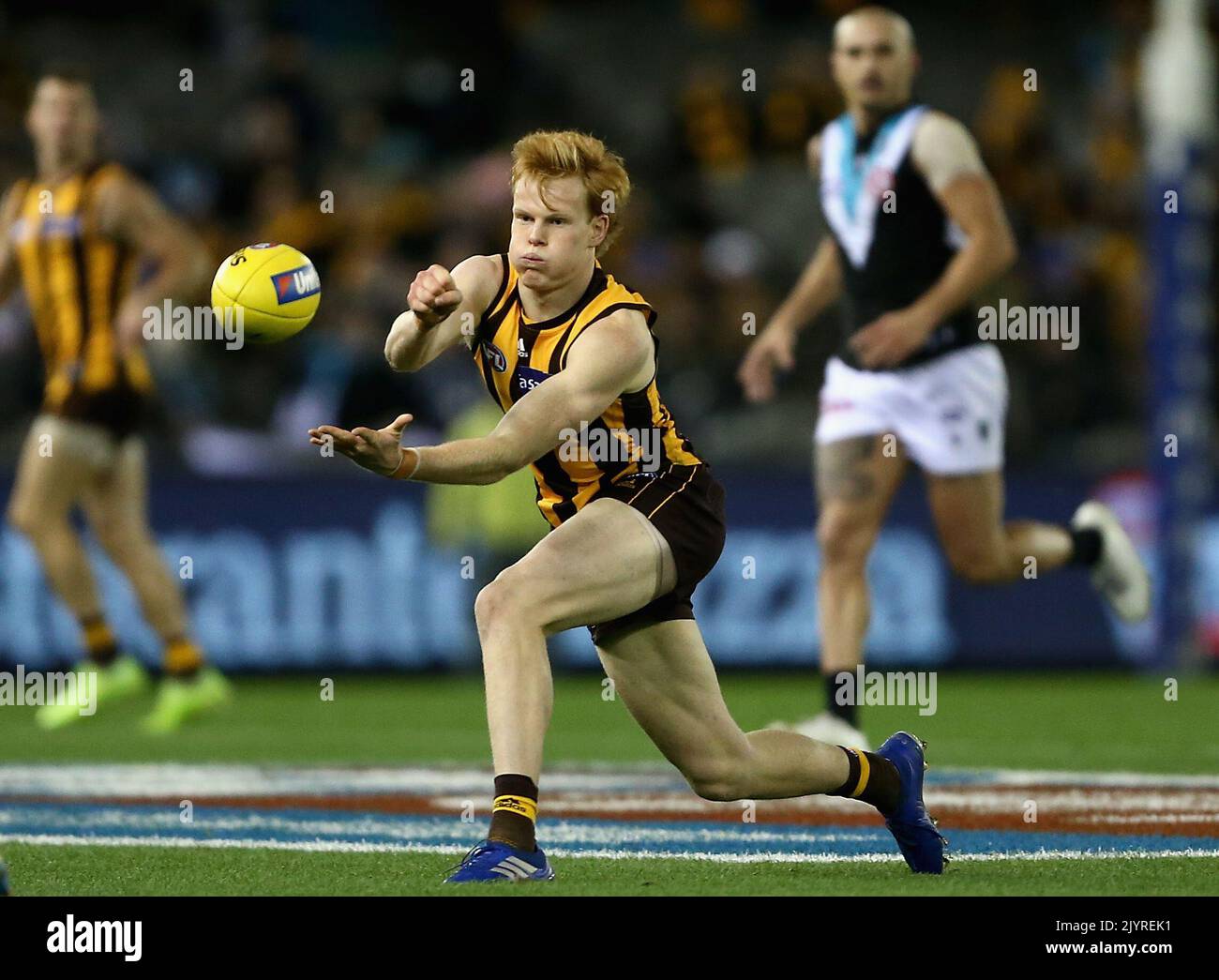 Damon Greaves of the Hawks handballs during the AFL Round 16Êmatch ...