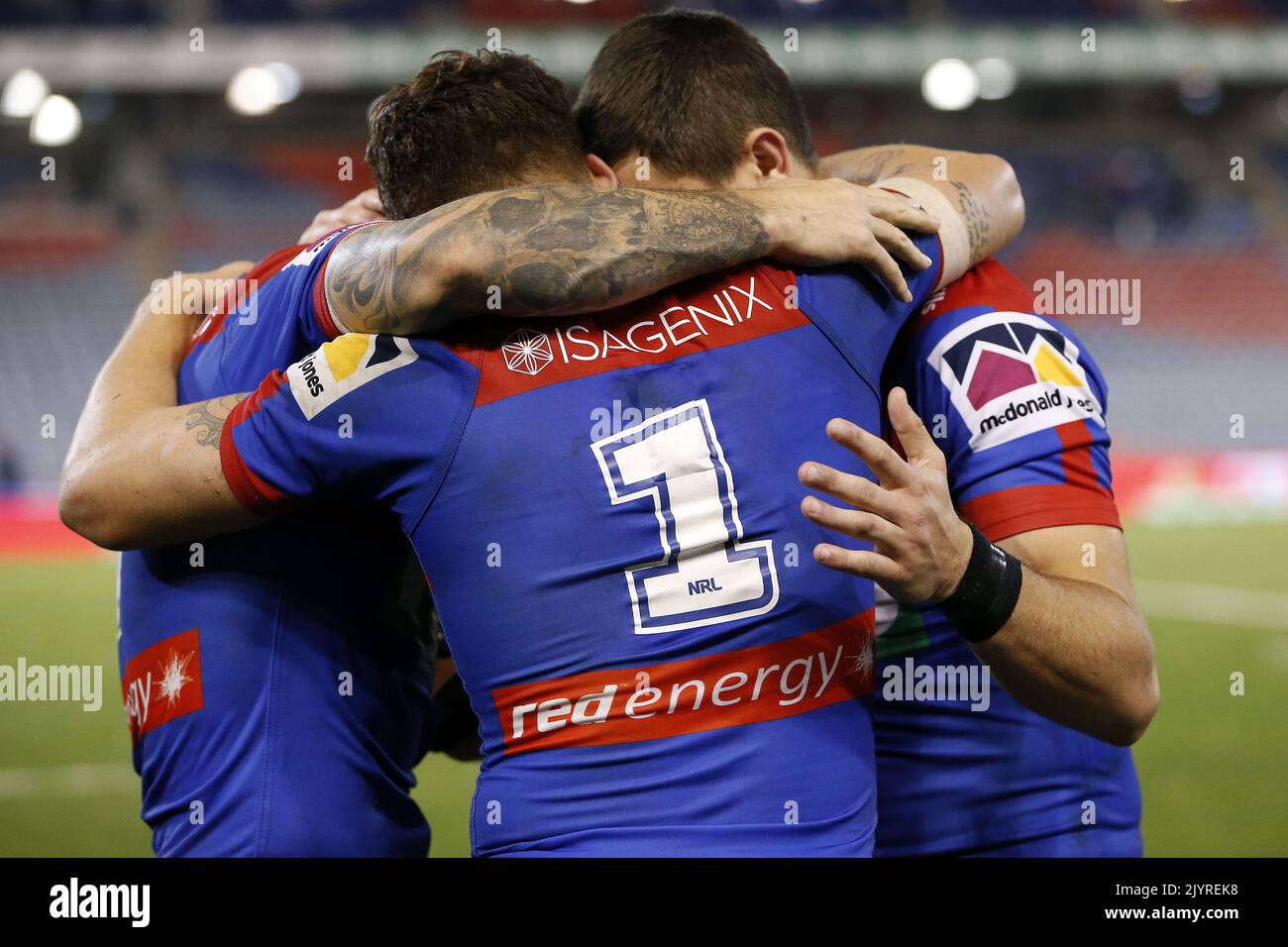 Kalyn Ponga of the Knights celebrates the win with Jake Clifford and ...