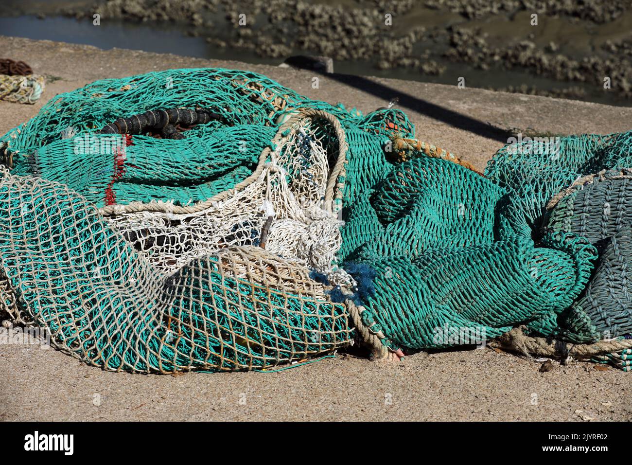 Fishing net in the harbor Stock Photo - Alamy