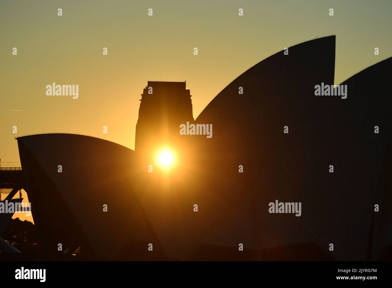 The sun is seen setting through the Sydney Harbour Bridge pylon lookout ...