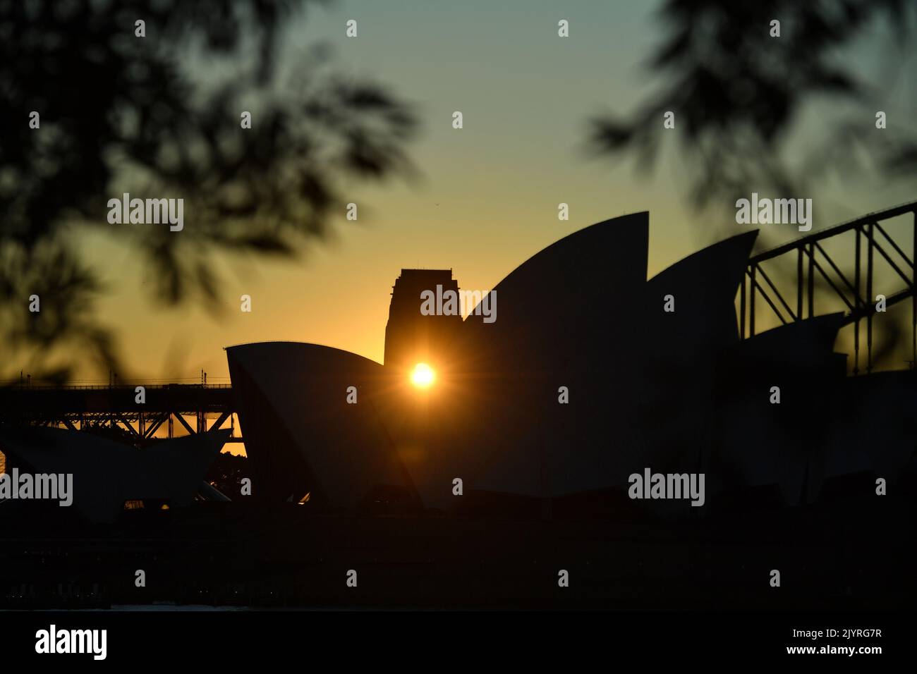 The sun is seen setting through the Sydney Harbour Bridge pylon lookout ...