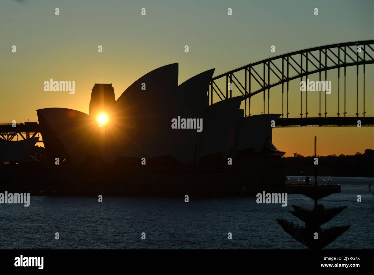 The sun is seen setting through the Sydney Harbour Bridge pylon lookout ...