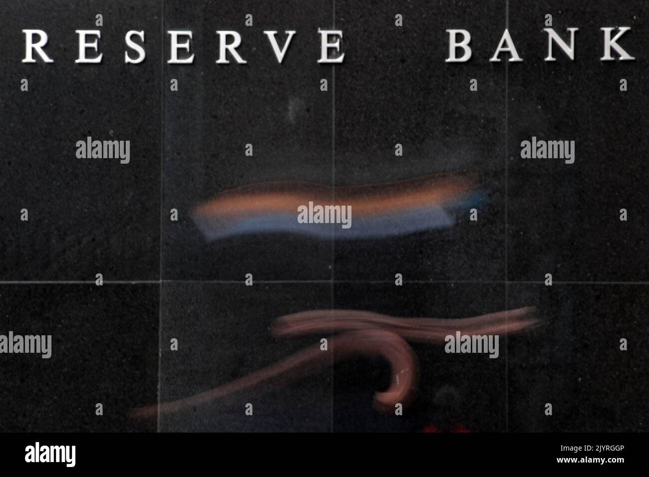 A pedestrian walks past the Reserve Bank of Australia (RBA) head office ...