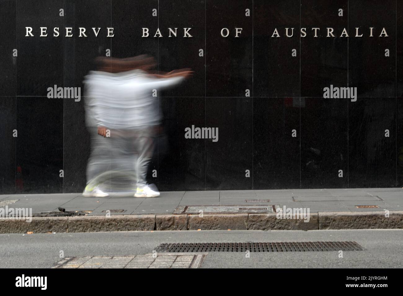 A pedestrian walks past the Reserve Bank of Australia (RBA) head office ...