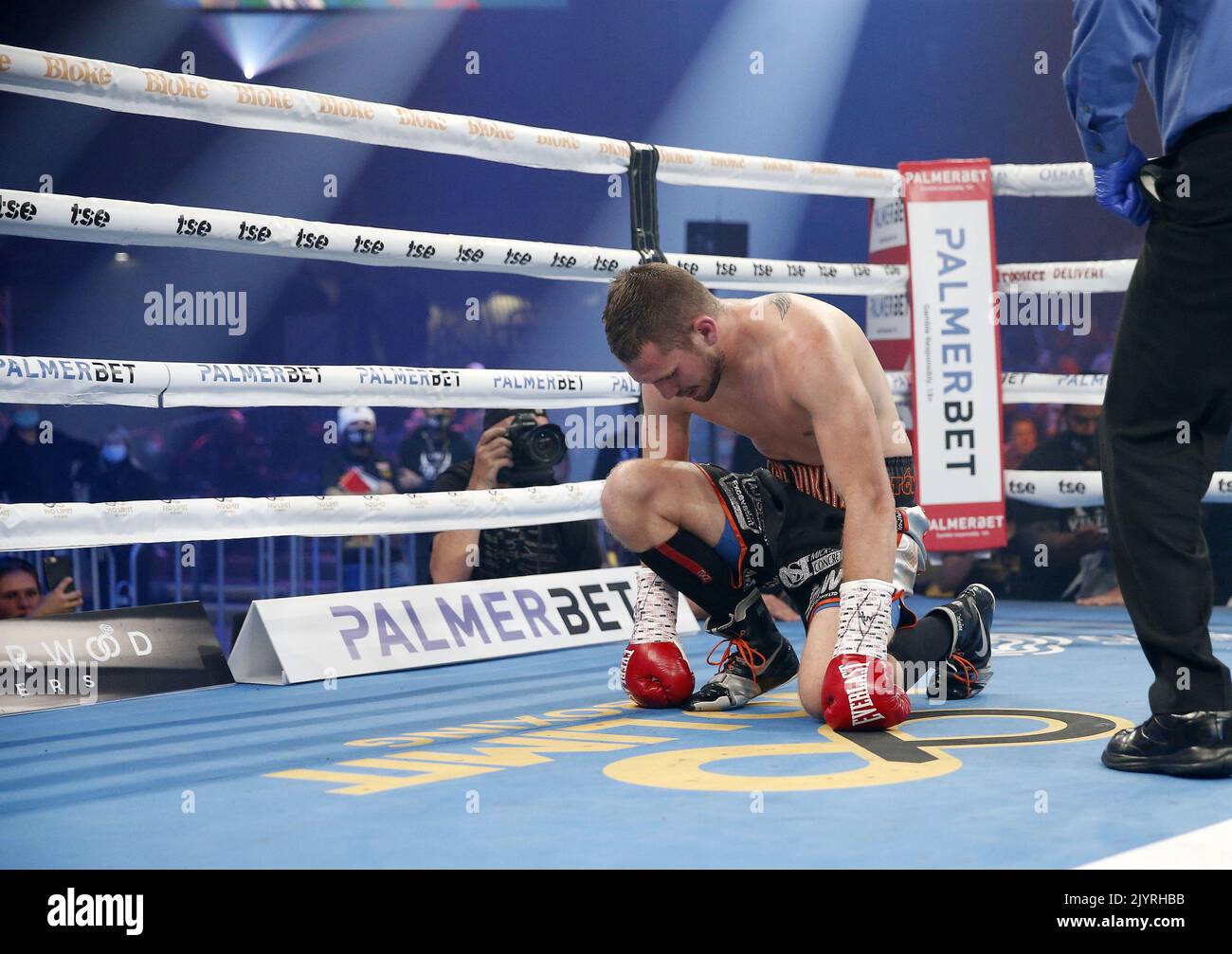 Stevie Spark is knocked down during the Commonwealth Super Welterweight ...