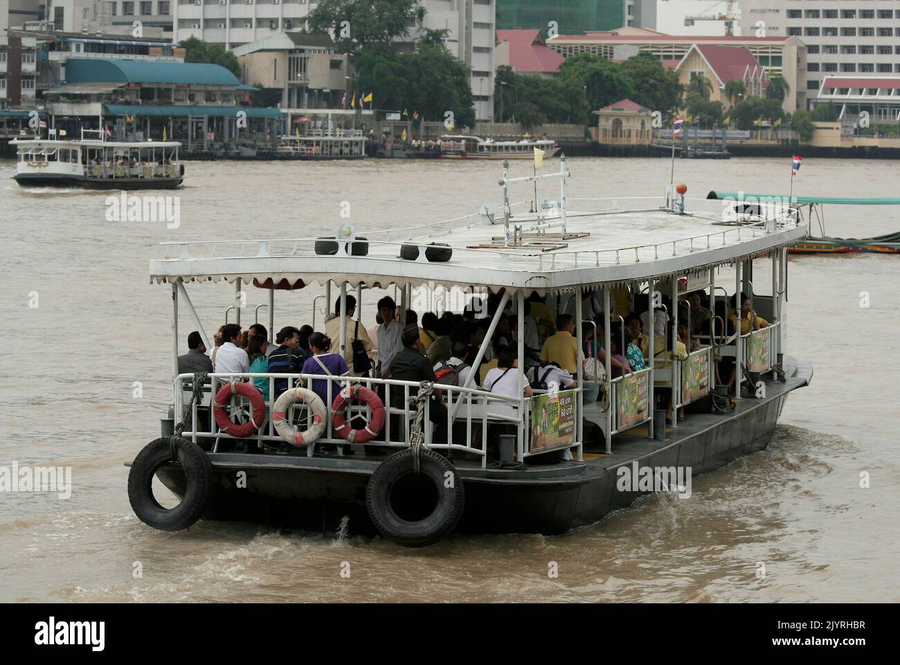 BANGKOK,THAILAND-JULY 07,2008:Passengers traveling with a Ferry on Chao ...
