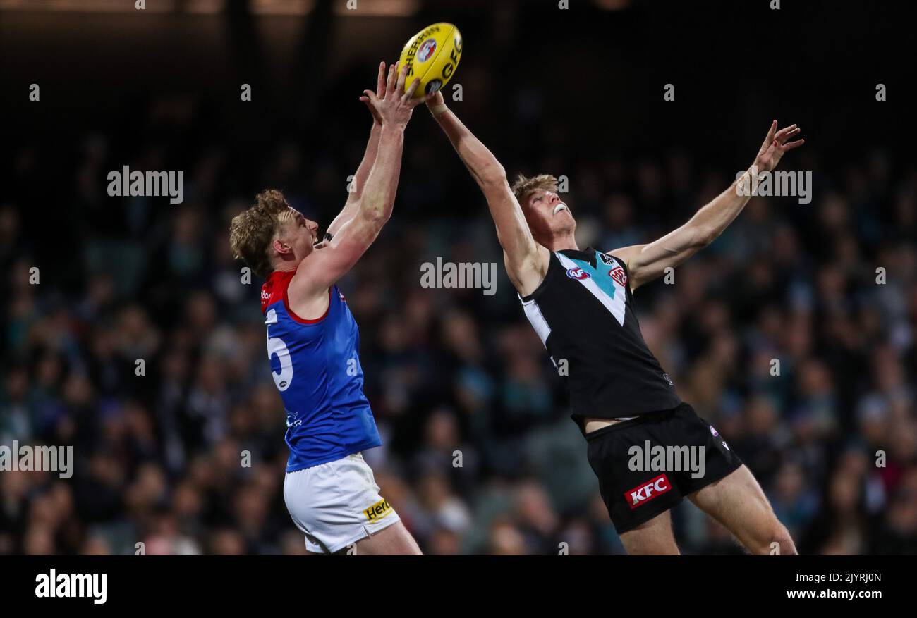 Harrison Petty of the Demons marks the ball over Todd Marshall of the ...