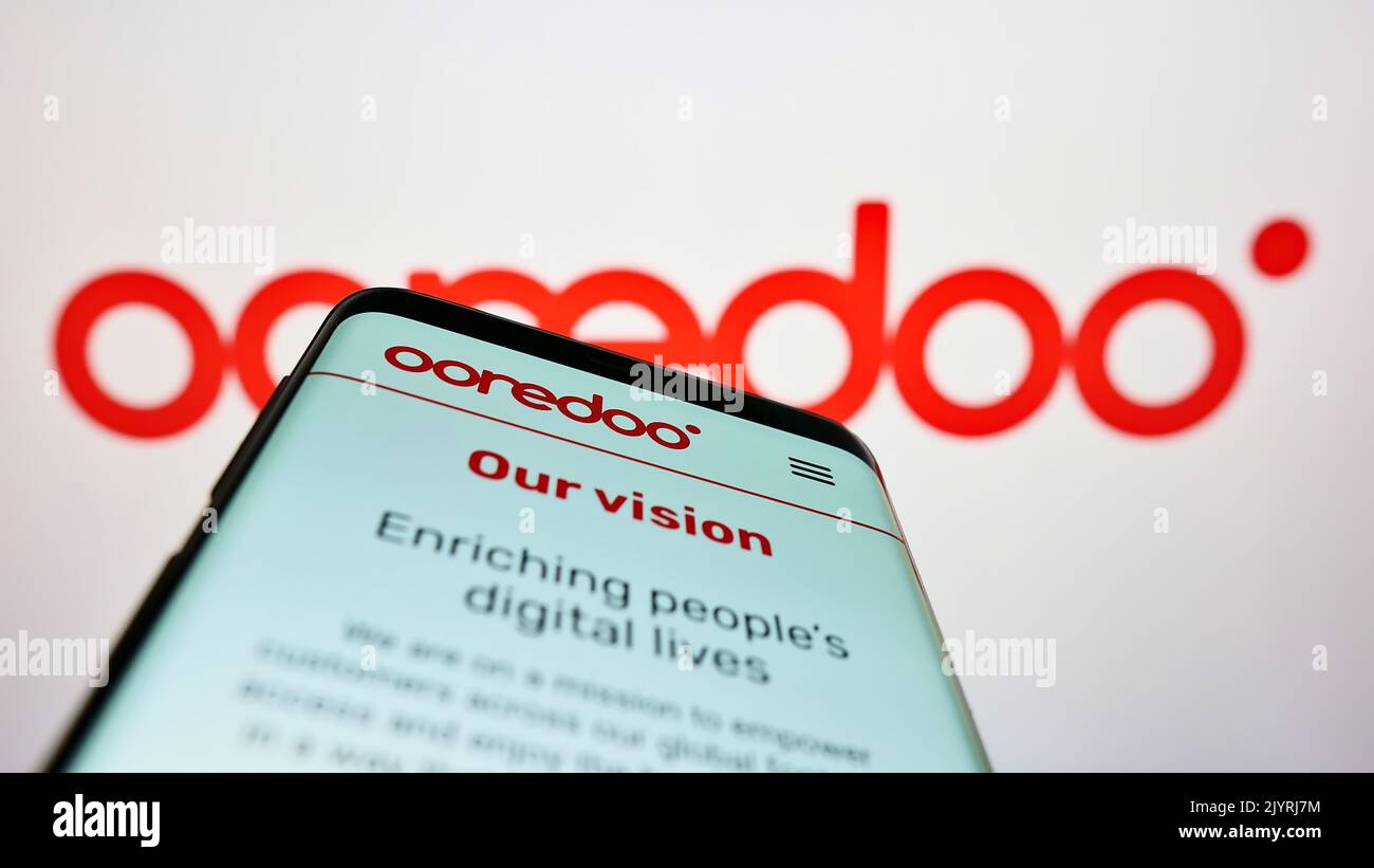Mobile phone with website of Qatari telecommunications company Ooredoo ...