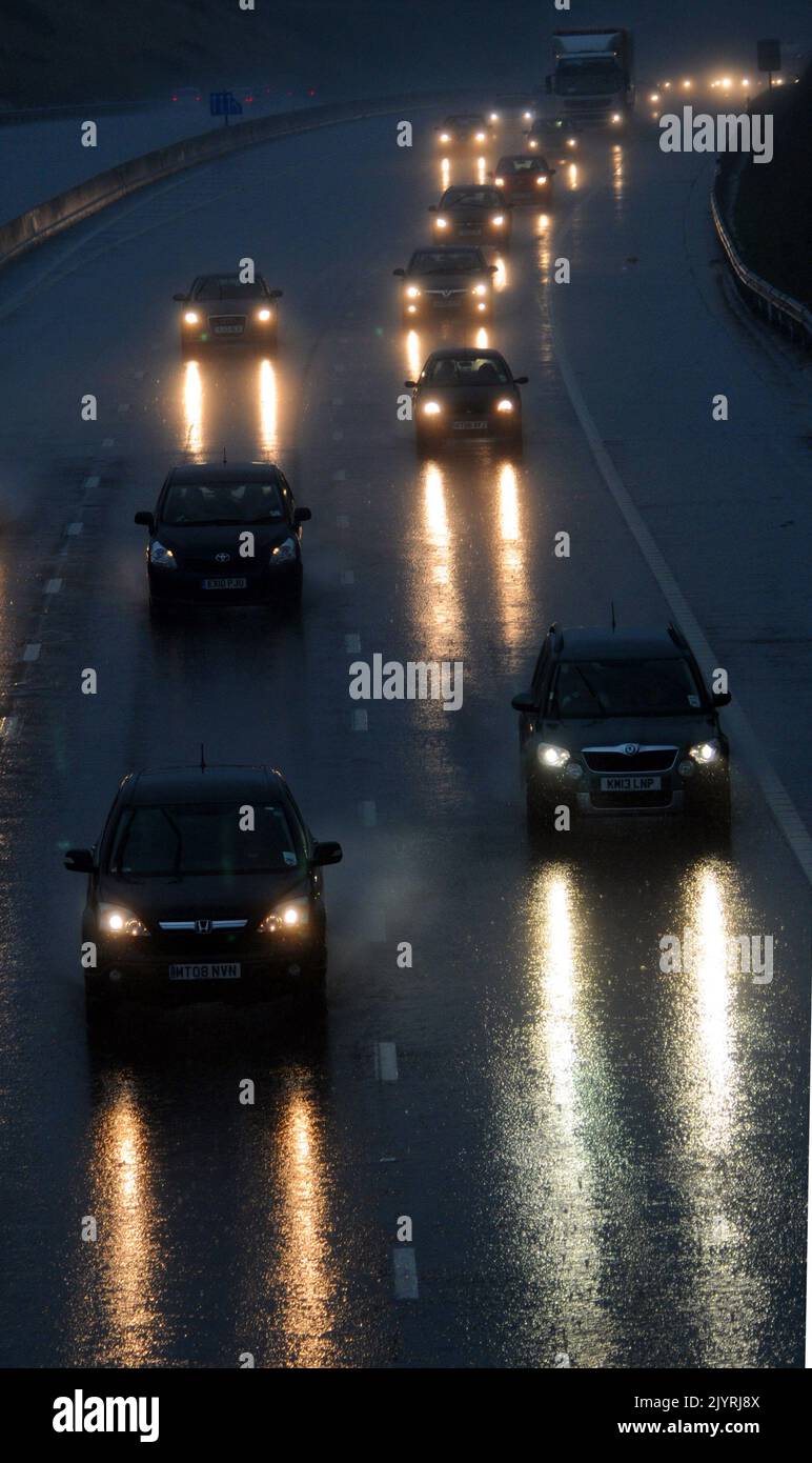ITS 1' O'CLOCK IN THE AFTERNOON AND CARS BATTLE THROUGH THE RAIN AND ...