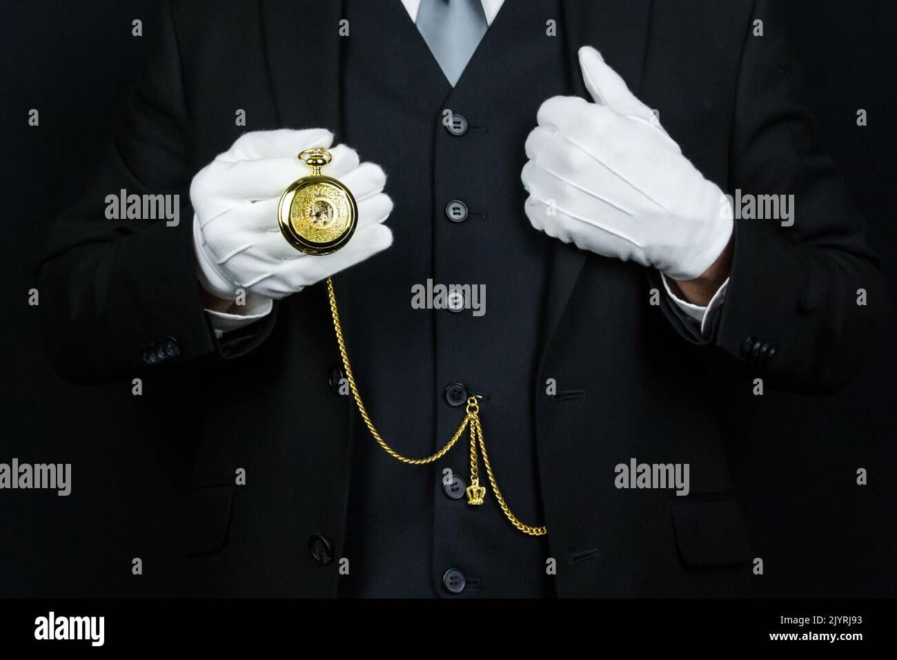 Portrait of Butler in Black Suit and White Gloves Holding Gold Pocket ...