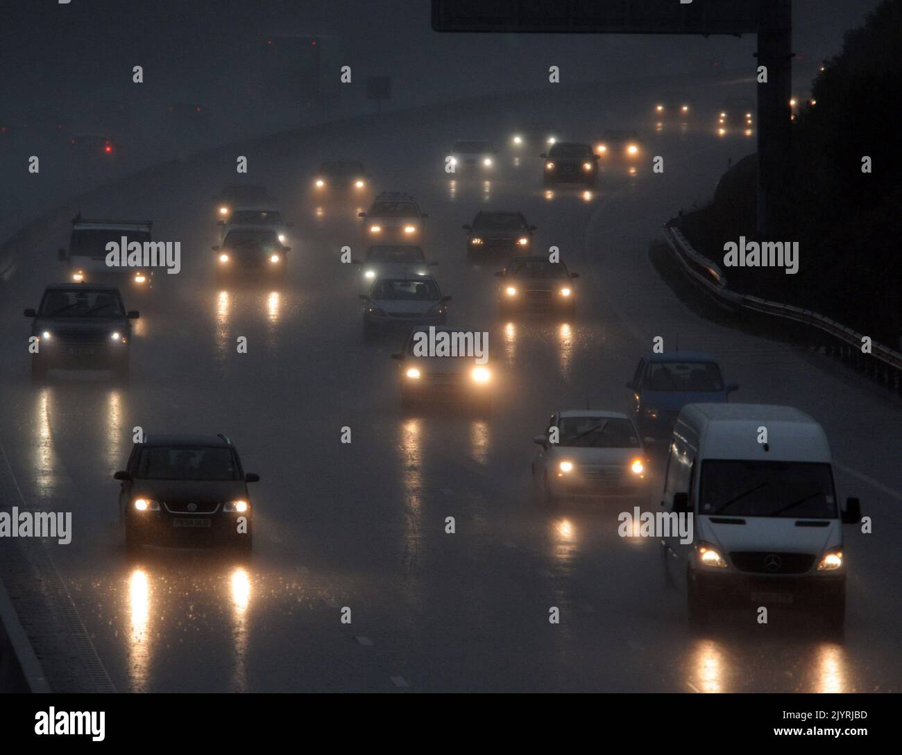 ITS 1' O'CLOCK IN THE AFTERNOON AND CARS BATTLE THROUGH THE RAIN AND ...