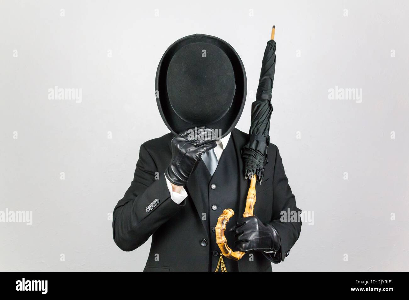 Businessman bowler hat umbrella hi-res stock photography and images - Alamy