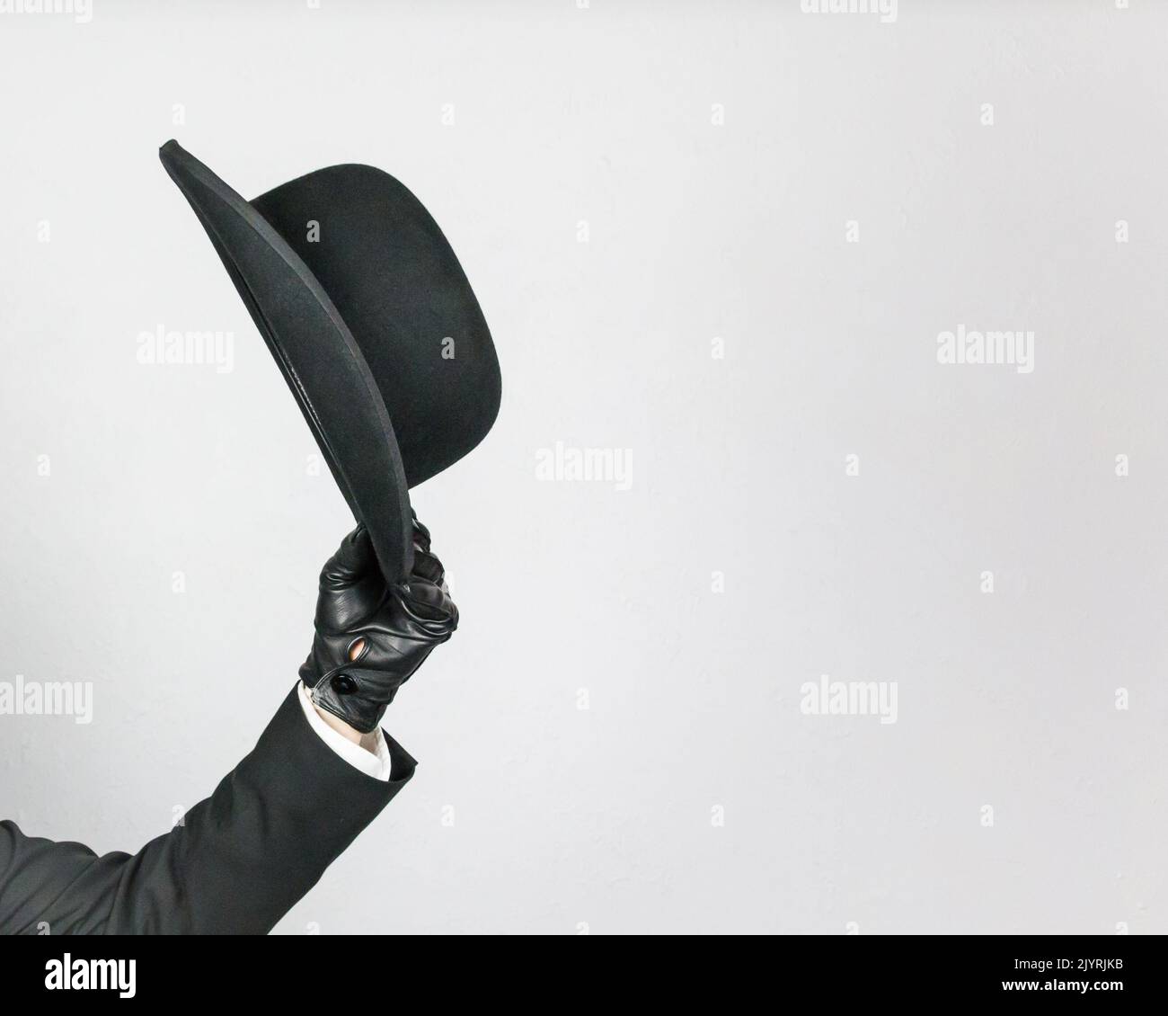 Isolated Image of Gentleman in Dark Suit and Leather Gloves Politely ...