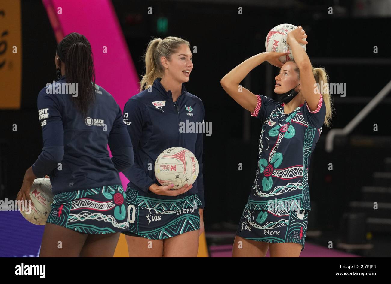 Ruby Barkmeyer of the Vixens and her teammates warm up prior to the ...