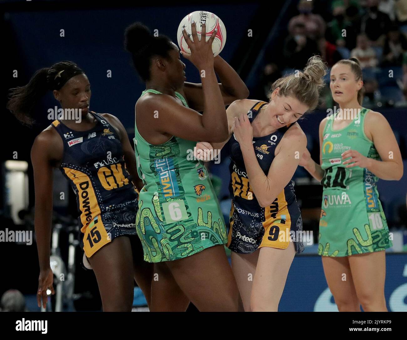 Jhaniele Fowler of the Fever wins the ball over Karla Pretorius of the ...