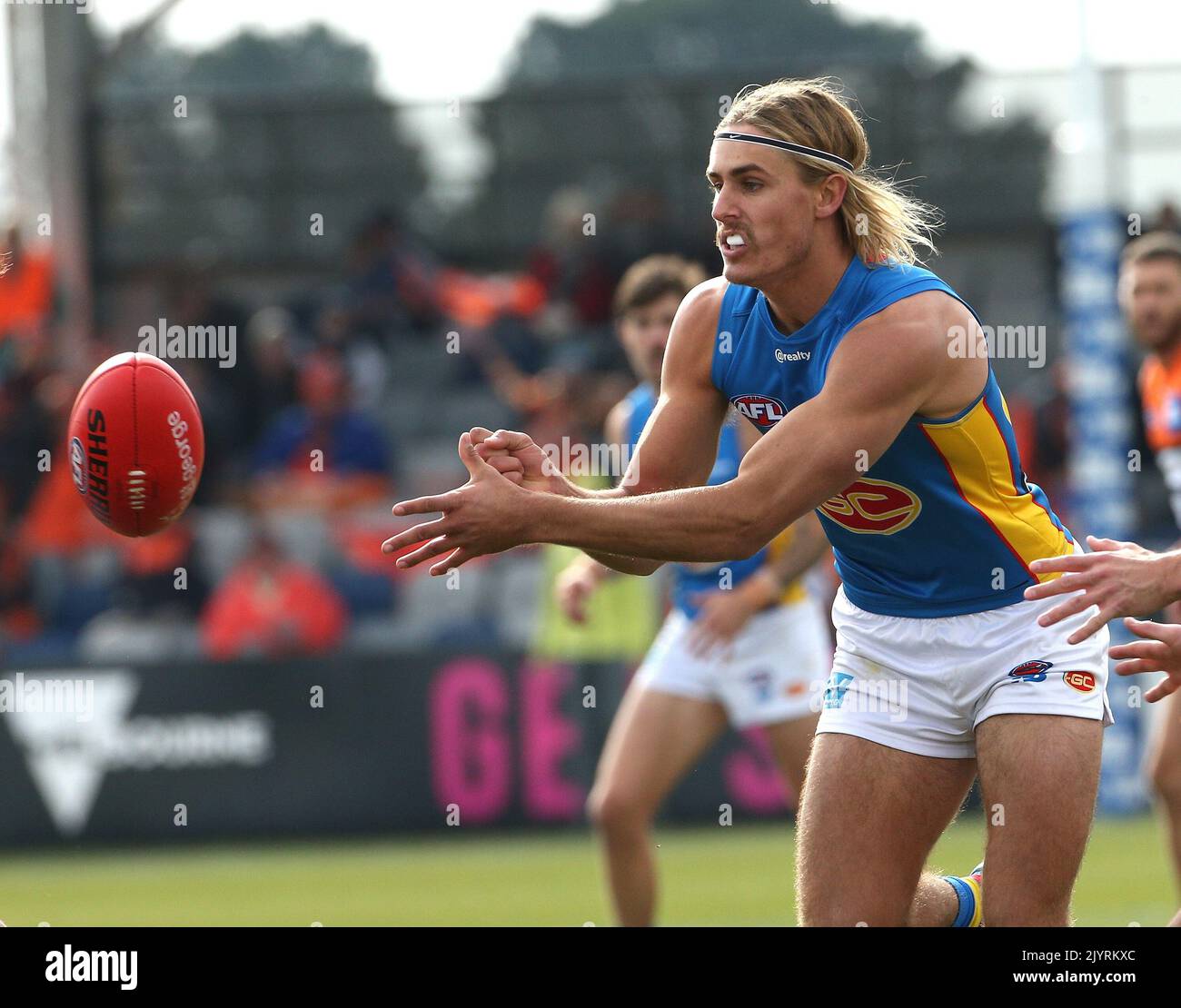 Jeremy Sharp of the Suns handpasses during the Round 17 AFL match ...