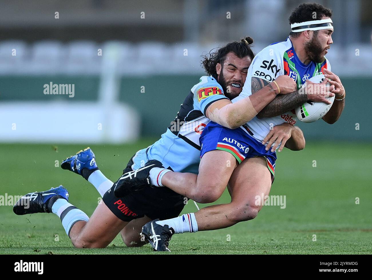Toby Rudolf of the Sharks tackles Jazz Tevaga of the Warriors during ...
