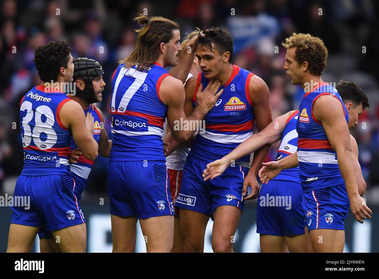 Jamarra-Ugle-Hagan of Western Bulldogs (2nd right) is embraced after ...