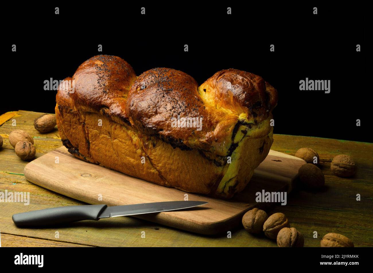 Slices of homemade traditional Romanian sweet bread. Loaf of bread on ...
