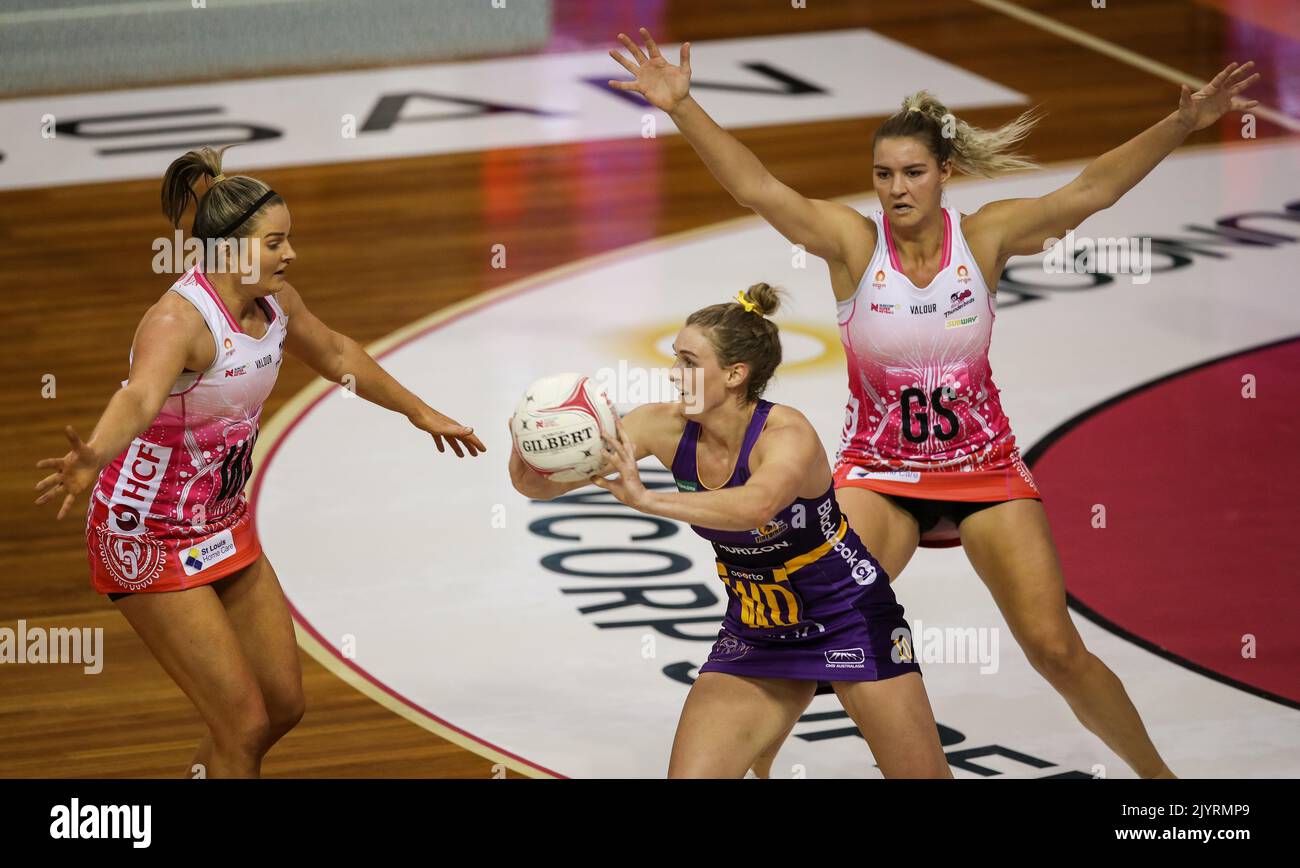 Gabi Simpson of the Firebirds challenged by Maisie Nankivell and Lenize ...