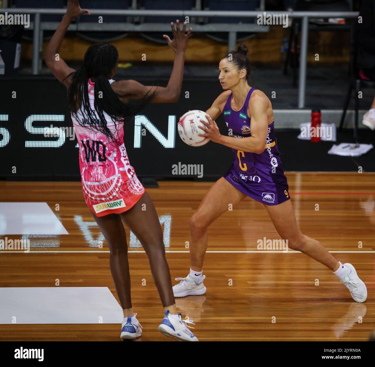 Kim Ravaillion of the Firebirds under pressure from Latanya Wilson of ...