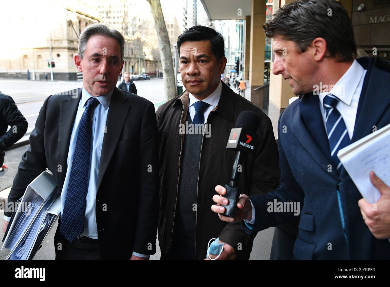 Simiona Tuteru (centre) departs the Melbourne Magistrates Court in ...