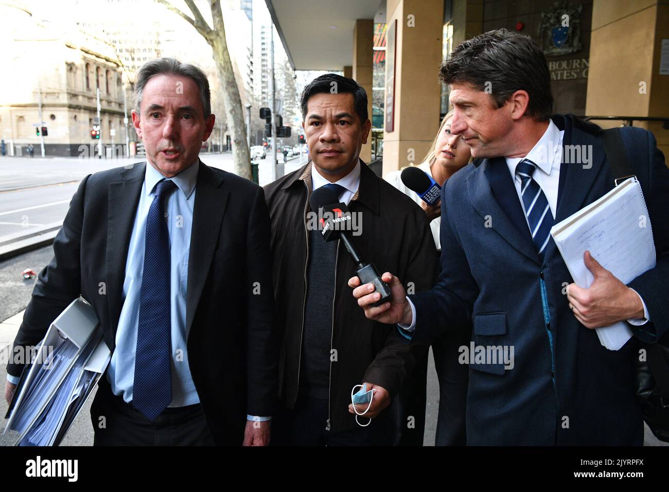 Simiona Tuteru (centre) departs the Melbourne Magistrates Court in ...