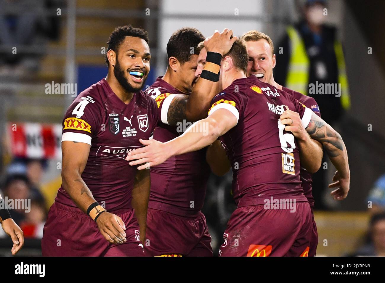 Hamiso Tabuai-Fidow of the Maroons (left) celebrates after scoring a ...