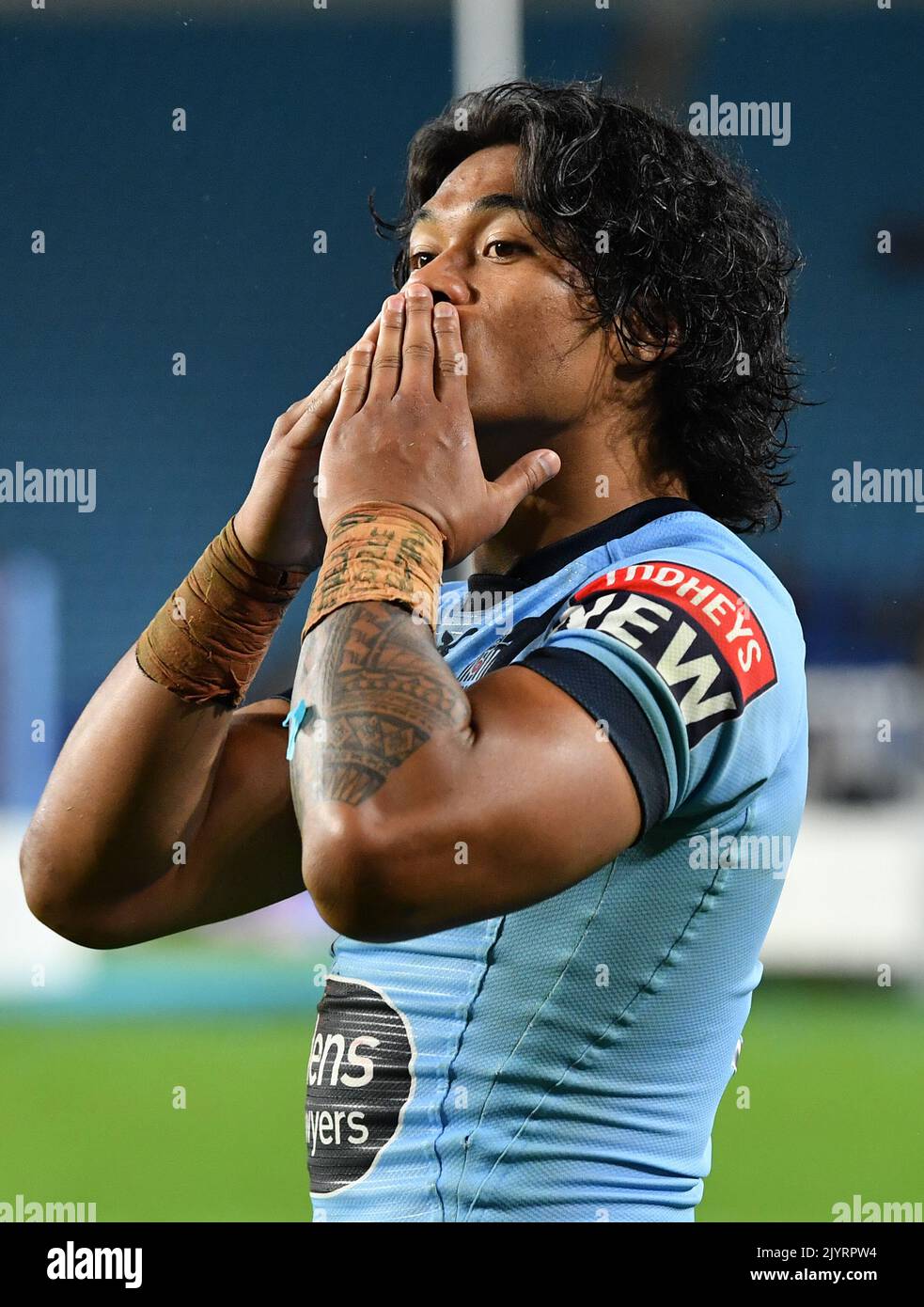 Brian To'o of the Blues blowskiises to the fans as he celebrates ...