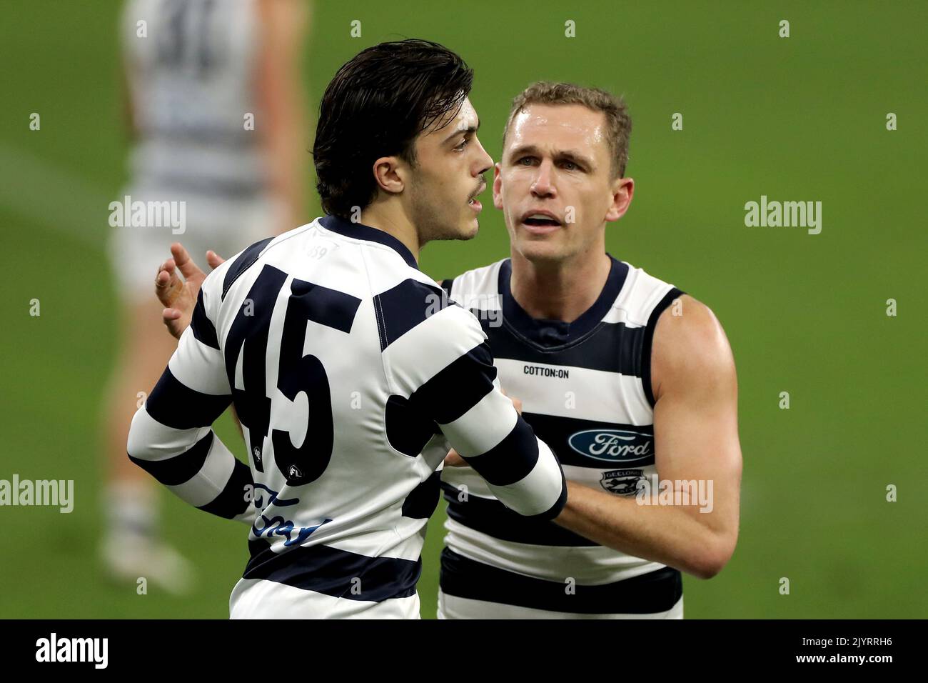 Bradley Close of the Cats is congratulated by Joel Selwood after ...