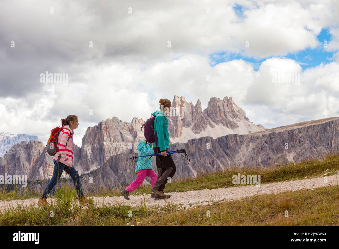 happy family - smiling mother and two sisters girls hikers at the ...