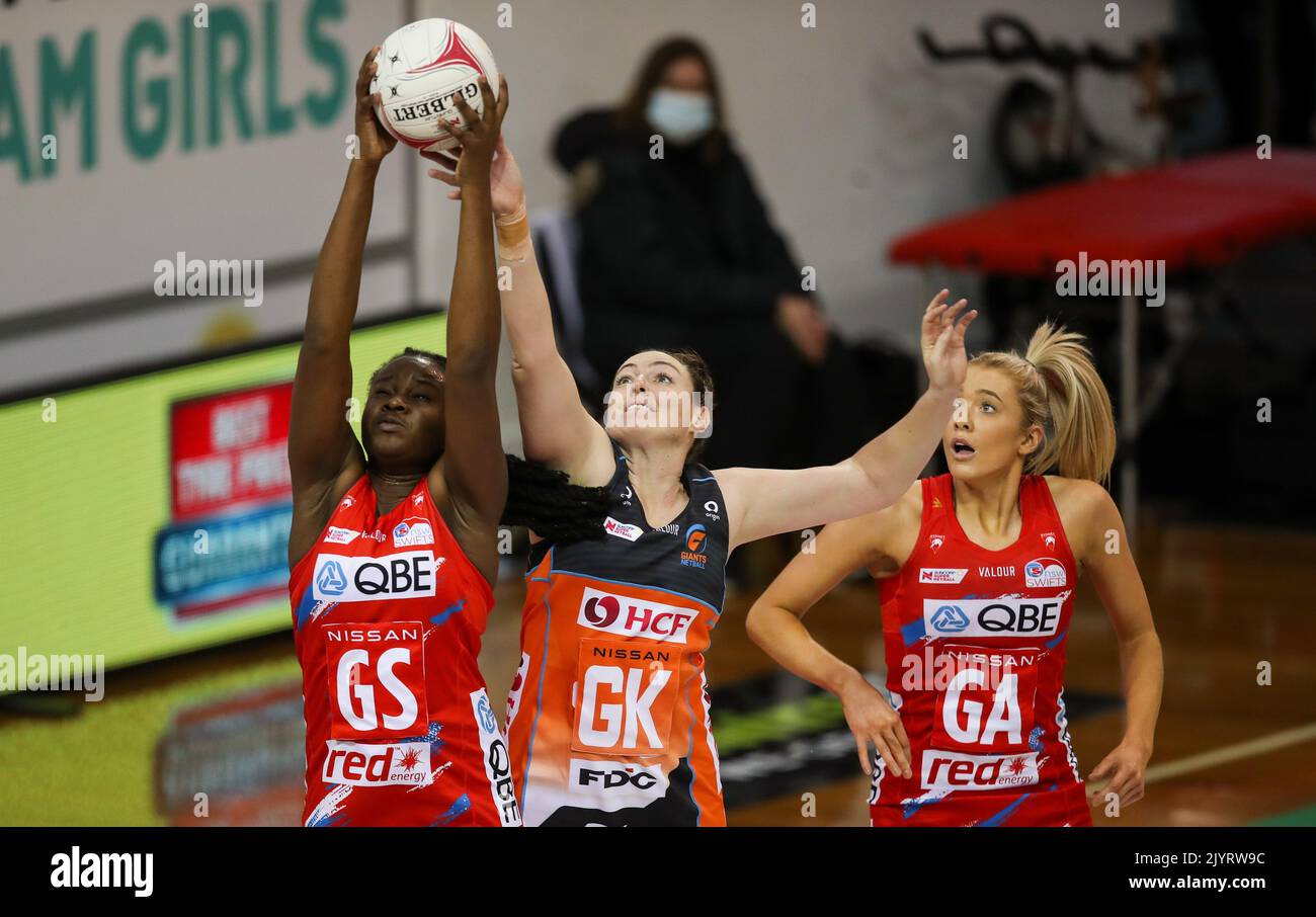 Sam Wallace of the Swifts and Sam Poolman of the Giants compete for the ...