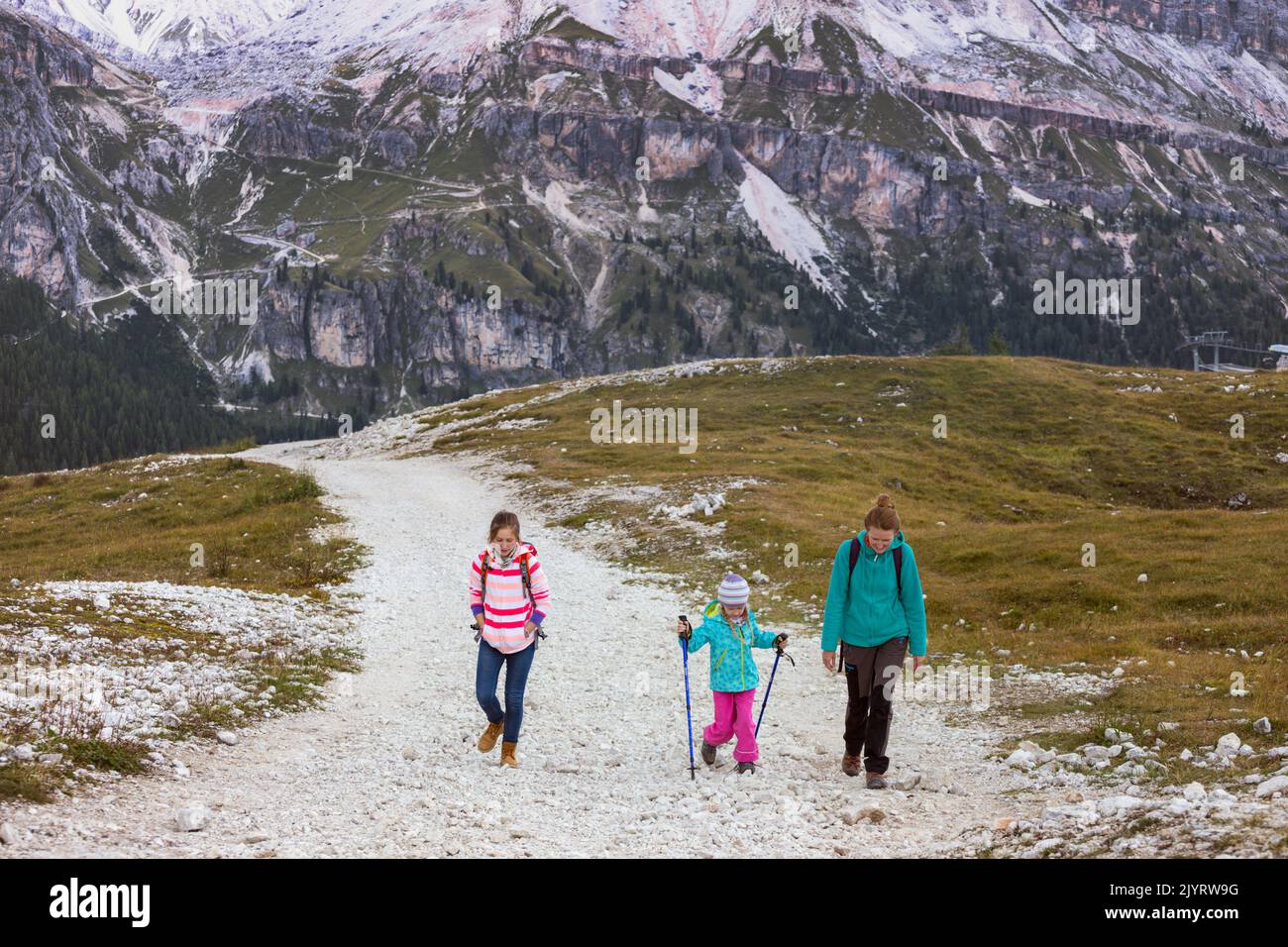 happy family - smiling mother and two sisters girls hikers at the ...